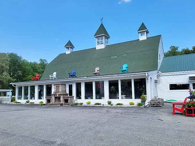 Colorful Adirondack chairs on the roofline, a stone fireplace out front &mdash; Arnold Farms has personality to spare and charm by the acre.