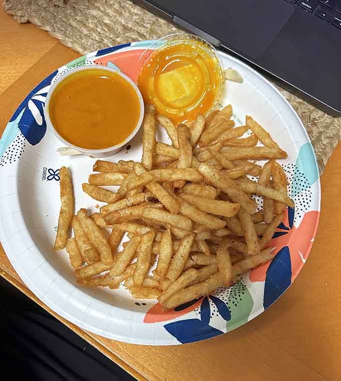 Perfectly seasoned fries with dipping sauce on standby, the kind of simple, satisfying side that pairs beautifully with everything on the menu.
