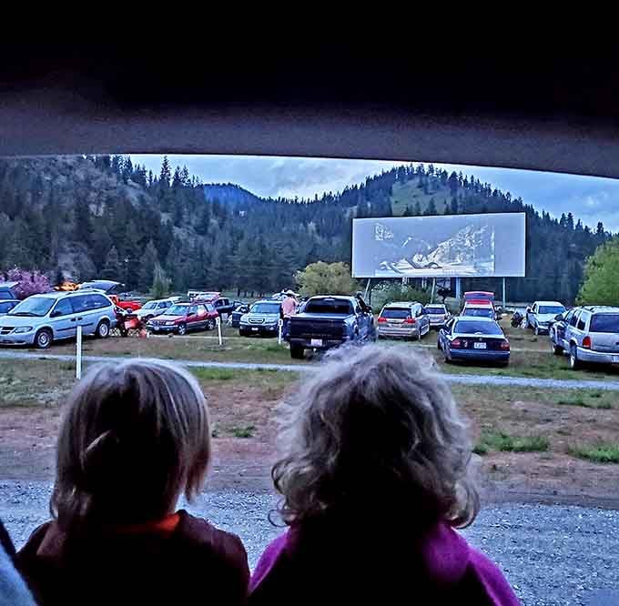 Two kids watching a movie from the back seat. Some memories don't need a filter or a caption.