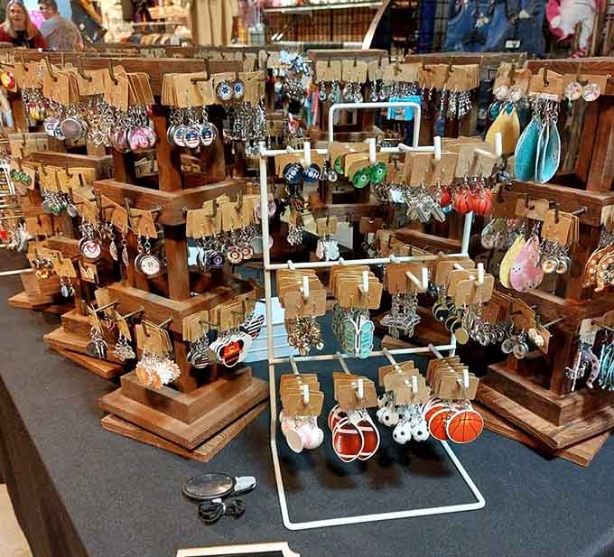 Handmade earrings displayed on wooden stands, each pair a tiny work of art worth finding.