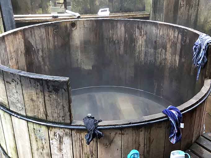 Steam curls off the surface of a cedar soaking tub, whispering "you made the right call."
