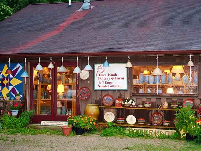 Colorful pottery displays outside a working studio where clay becomes art before your very eyes daily.