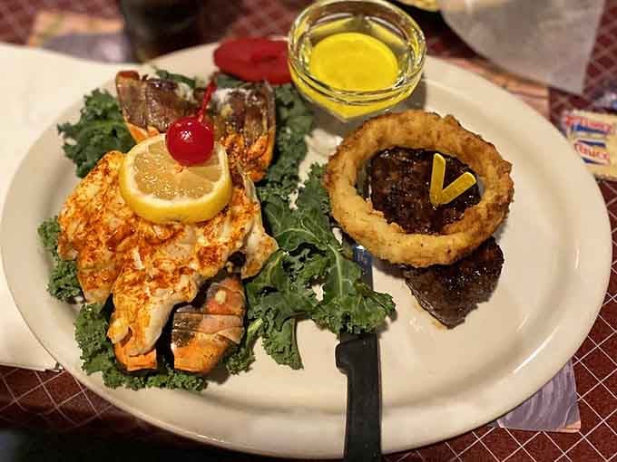 Surf and turf done right: lobster tail meets perfectly grilled steak in a marriage made in culinary heaven.