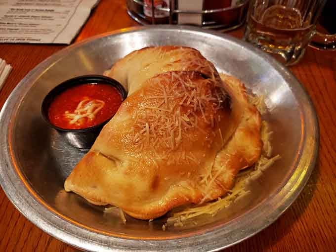 Golden, cheese-dusted, and served with marinara for dipping, this calzone arrived like a delicious surprise nobody saw coming.