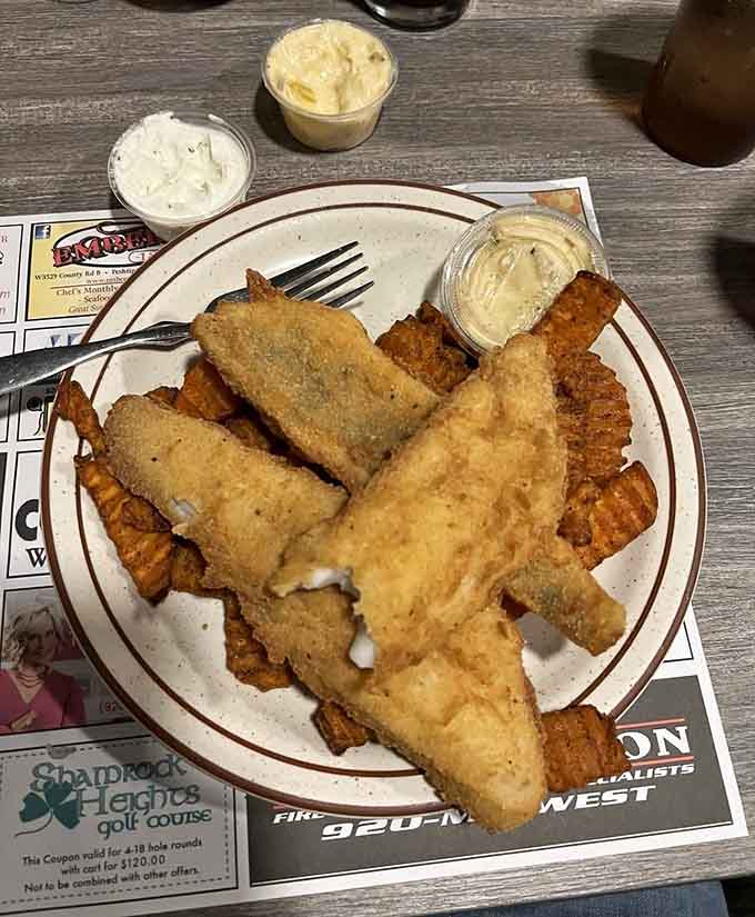 Golden fried fish with sweet potato waffle cuts, Wisconsin knows its way around a proper fish dinner, full stop.