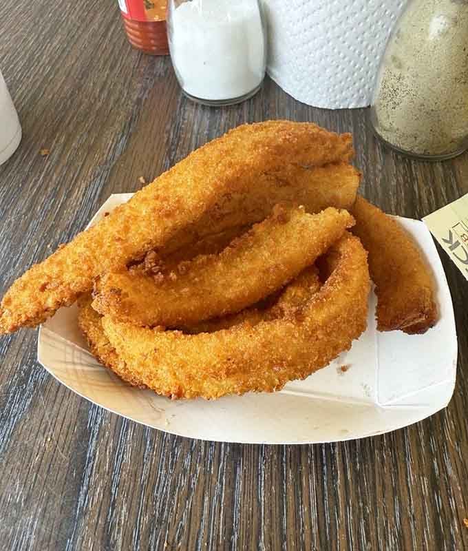 Golden, crispy, and generously sized onion rings that deserve their own fan club. The crunch on these is absolutely not playing around.