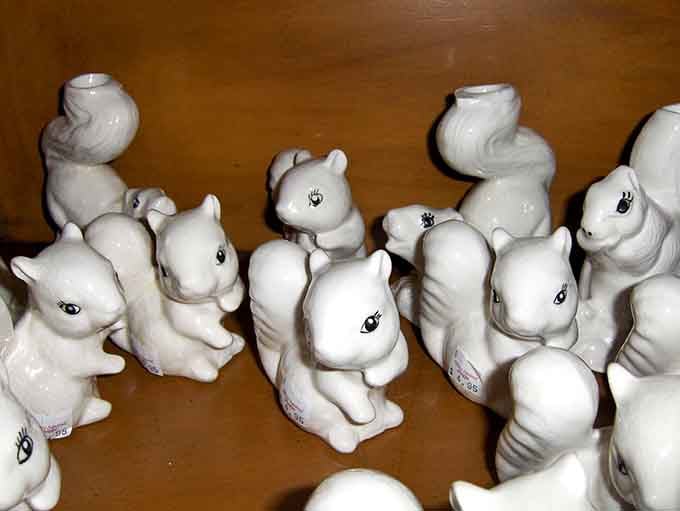 An army of ceramic white squirrels, each one cuter than the last and judging you quietly.