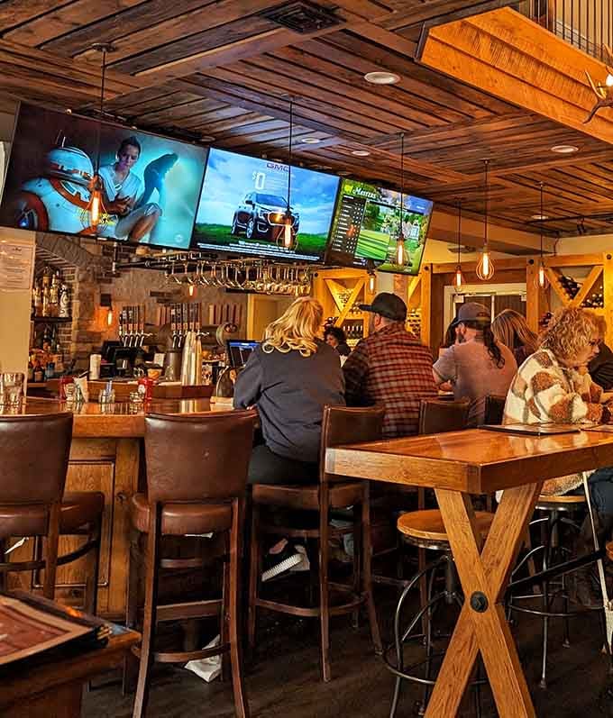Happy people, warm wood, big screens overhead — the Buck Hill bar area is exactly where you want to be.