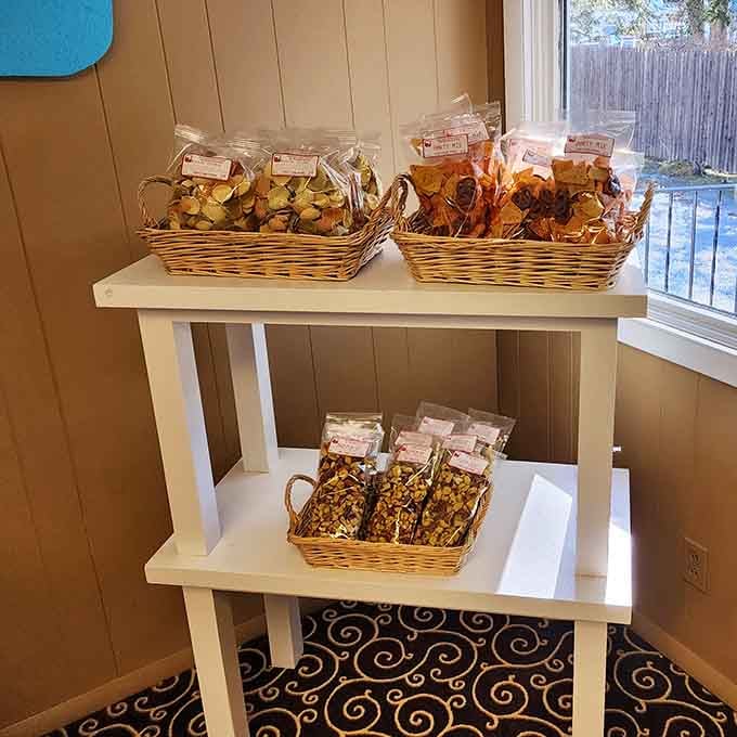 Fruit chips and party mixes tucked into wicker baskets, because even the snack corner here looks inviting.