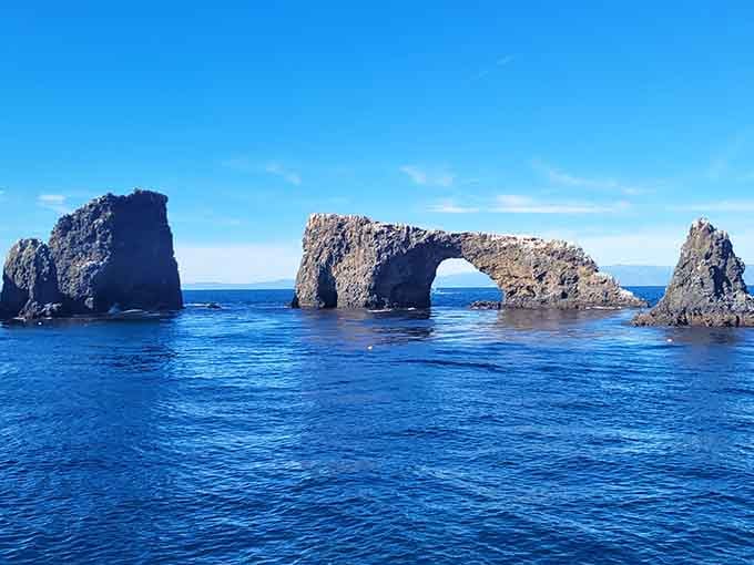 Arch Rock standing proud in the Pacific, nature's own gateway to an underwater world worth exploring.