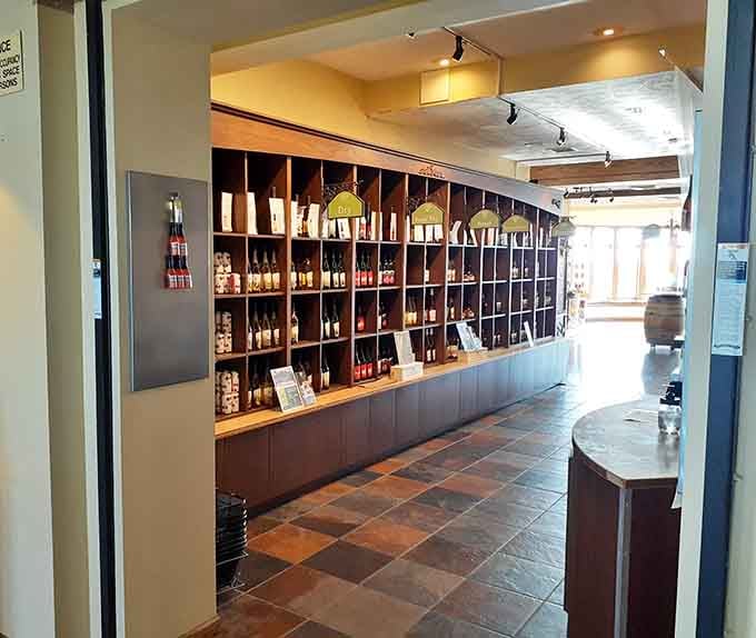 Floor-to-ceiling bottles organized by style, because choosing your next favorite wine deserves its own dedicated wall of options.