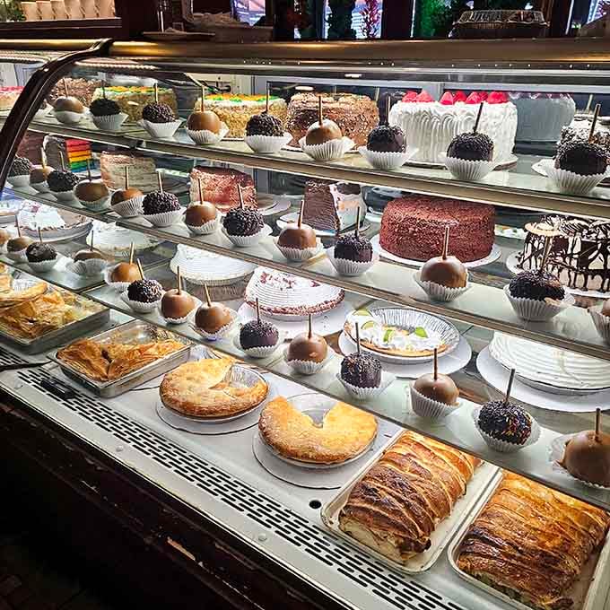 That dessert case is basically a museum exhibit titled "Reasons to Save Room." Caramel apples front and center.