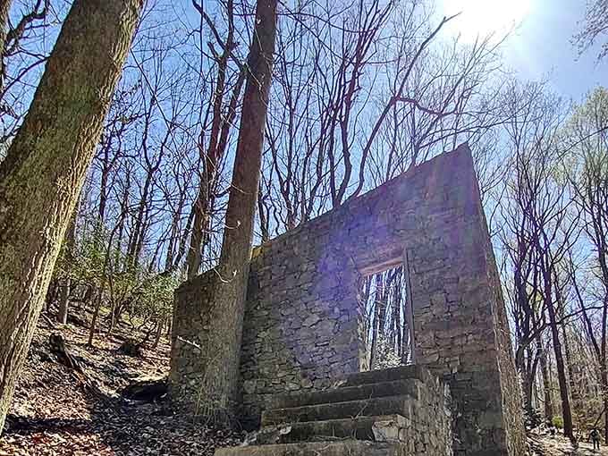 Stone steps reach toward a bright blue sky, framing a doorway that now opens onto pure possibility.