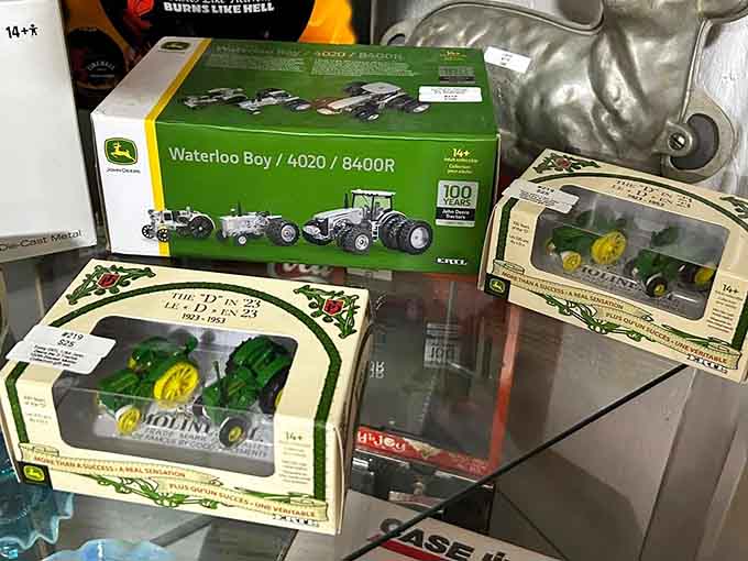 John Deere die-cast tractor collectibles still in the box, because some things are simply too good to open.