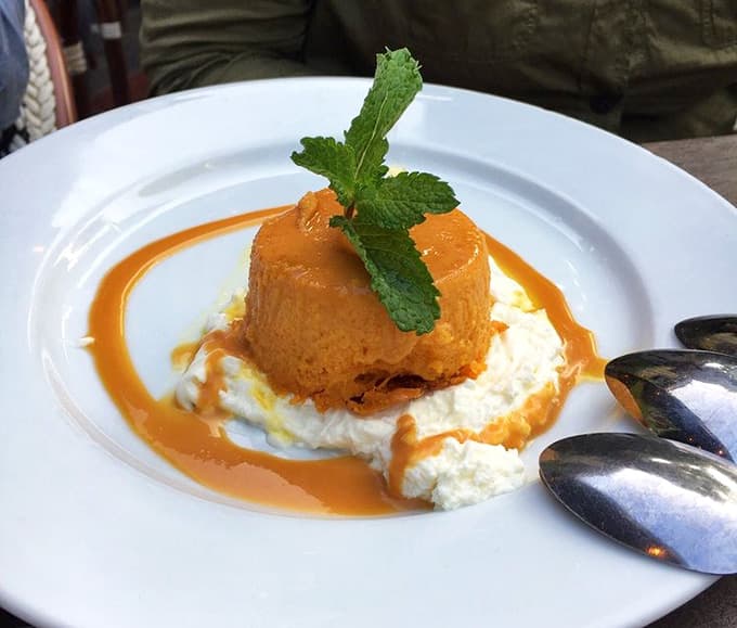 Mango flan topped with whipped cream and caramel is basically sunshine transformed into edible form somehow.
