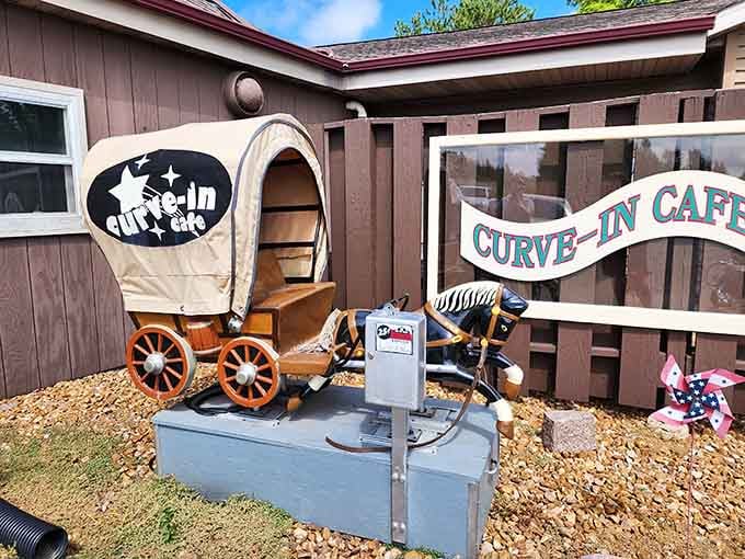 A vintage coin-operated covered wagon outside the cafe. Because why not start the adventure before you even walk in.