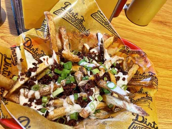 Hand-cut fries loaded with toppings and scallions, because plain fries are for people who've given up on joy.