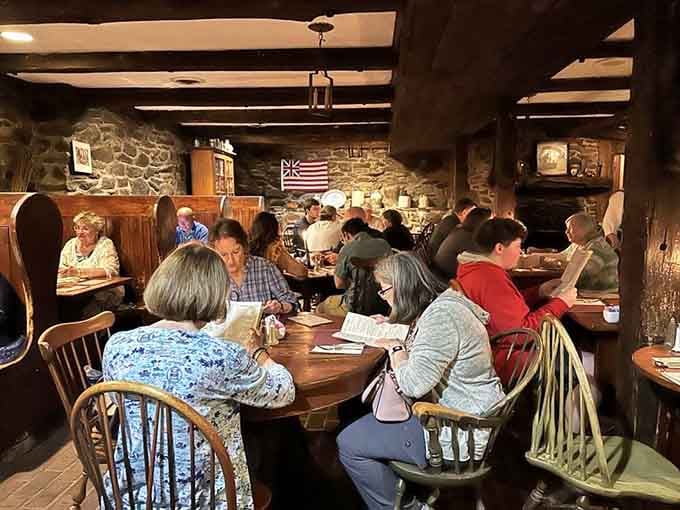 A full house of happy diners beneath an early American flag. Some rooms just have a way of pulling people together.