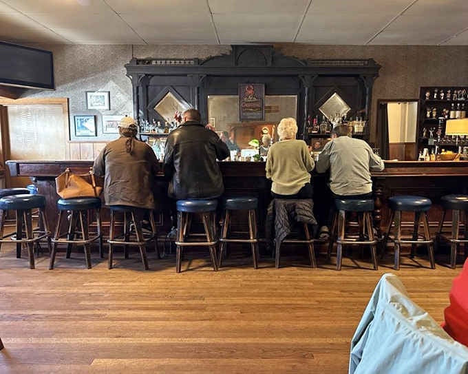 Locals settled in at the bar, shoulders relaxed, nobody rushing. This is what a real neighborhood tavern looks like.