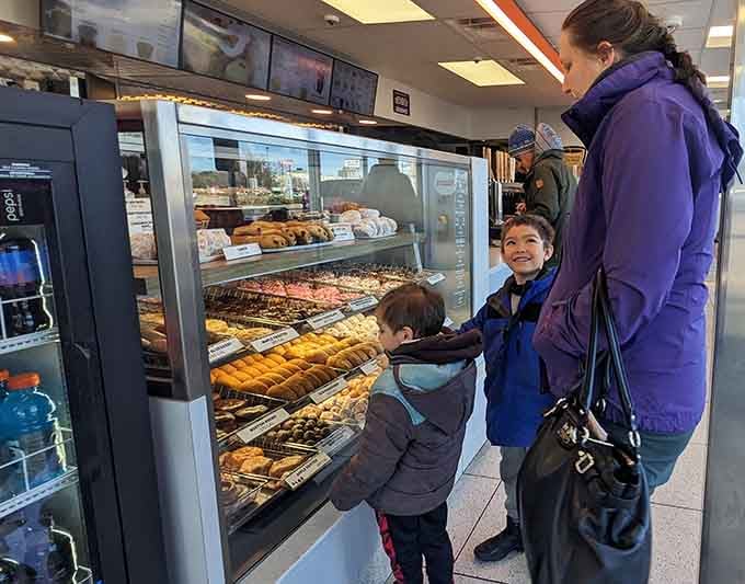 The next generation discovers what their grandparents already knew: picking out donuts is serious business requiring careful consideration and pointing.