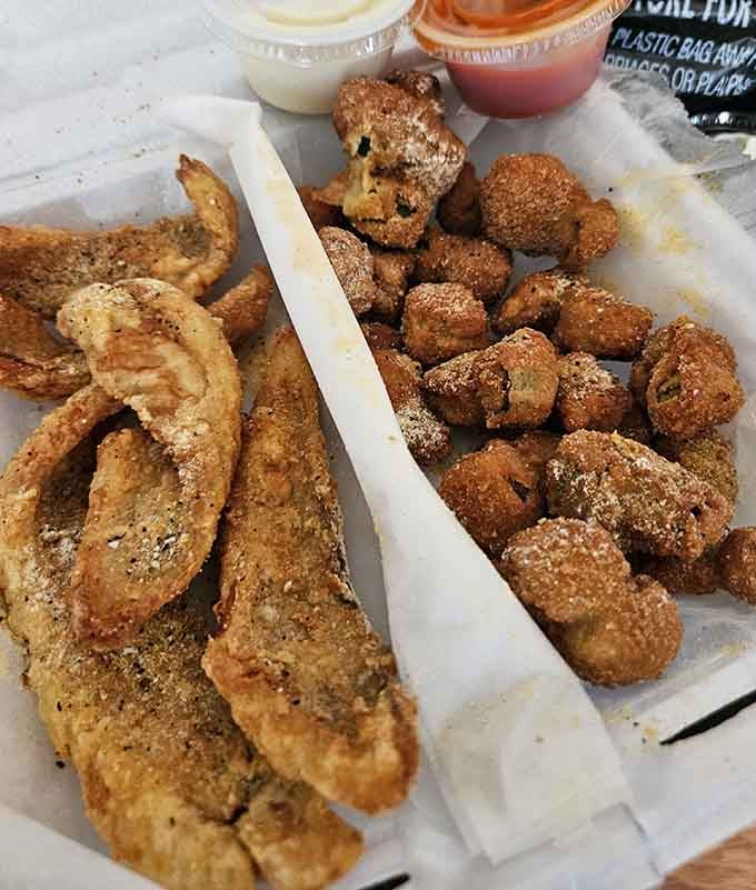 Crispy fish fillets sharing real estate with fried okra nuggets; this tray is a Southern-Midwestern friendship story.
