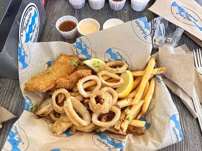 The fried combo delivers crispy calamari rings, golden fish, and a mountain of fries. Sharing is optional and honestly discouraged.