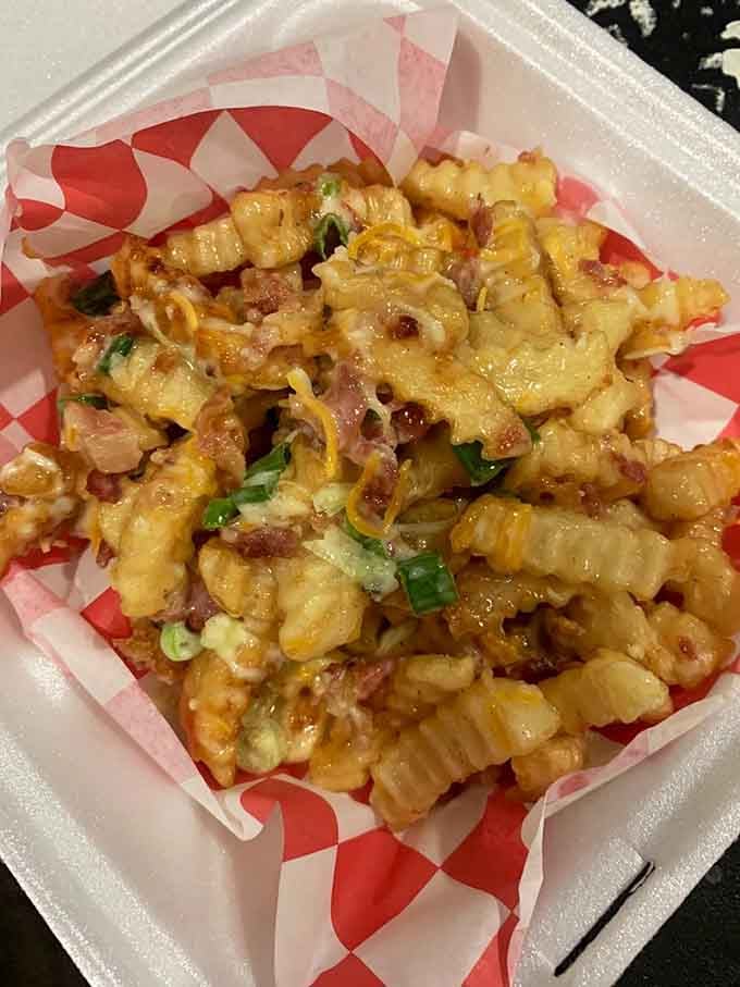 Loaded fries topped with enough deliciousness to make you forget what plain potatoes even taste like anymore, honestly.