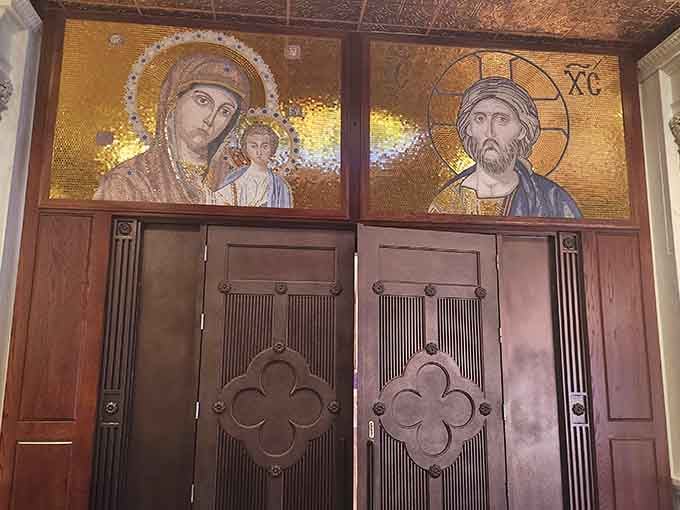 Golden mosaic panels above the entrance doors set the tone before you've even stepped inside.