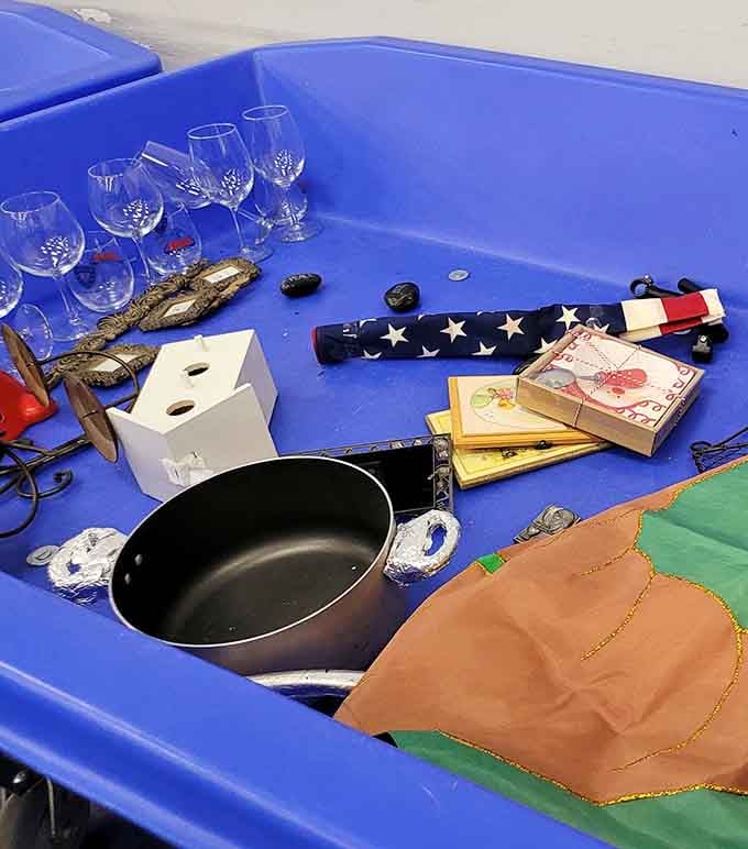 Wine glasses, cookware, and random treasures sharing one bin. Tuesday never looked this interesting.
