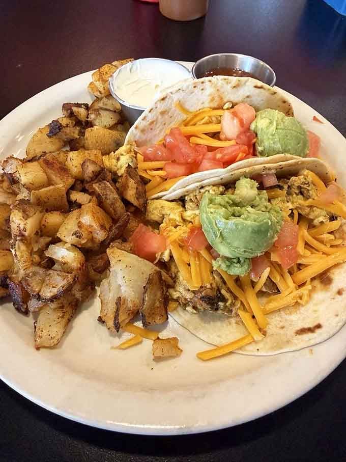 Scrambled eggs, cheddar, avocado, and tomato tucked into warm tortillas. These breakfast tacos are the real Cleveland morning ritual.