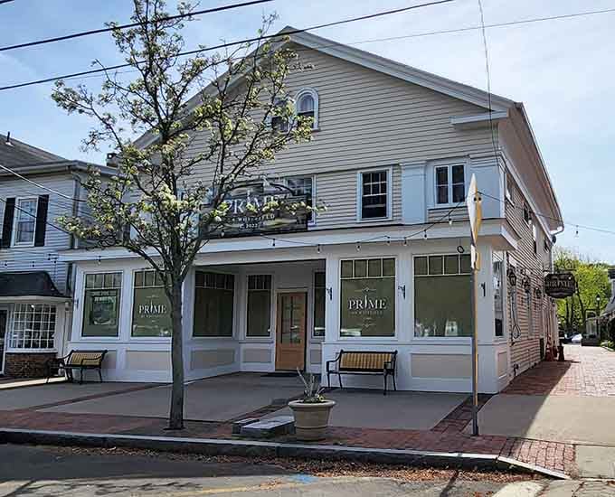 Prime on Whitfield brings serious dining energy to Guilford's downtown, with string lights and clean signage that mean business.