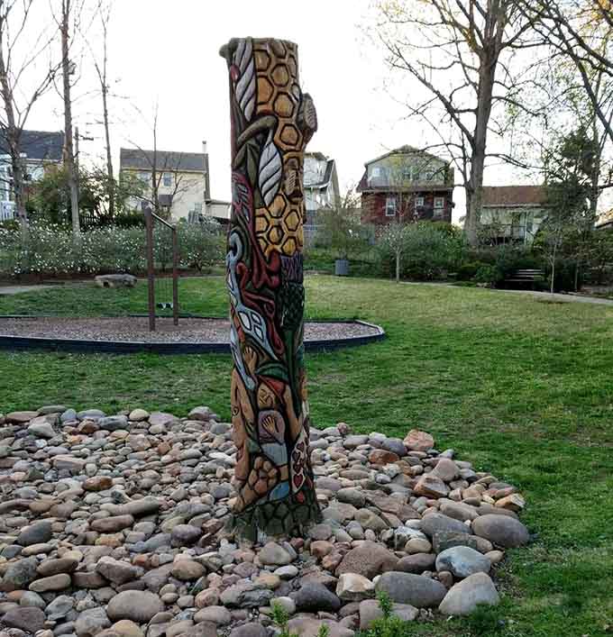 Honeycomb patterns, swirling colors, and natural imagery carved into wood. This sculpture rewards every single look you give it.