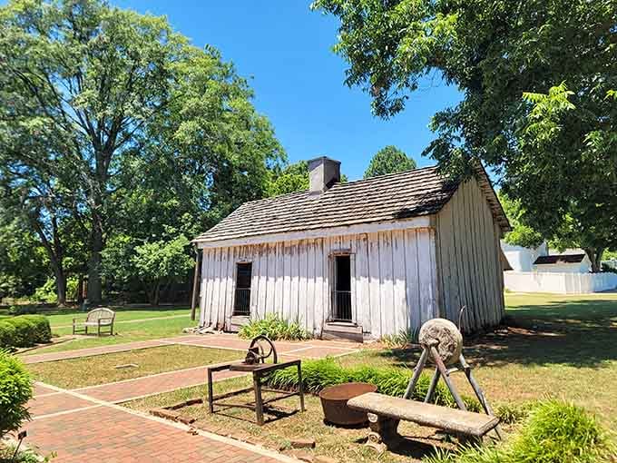 The cook's quarters stand weathered and honest, a reminder that Ivy Green's full story runs deep.