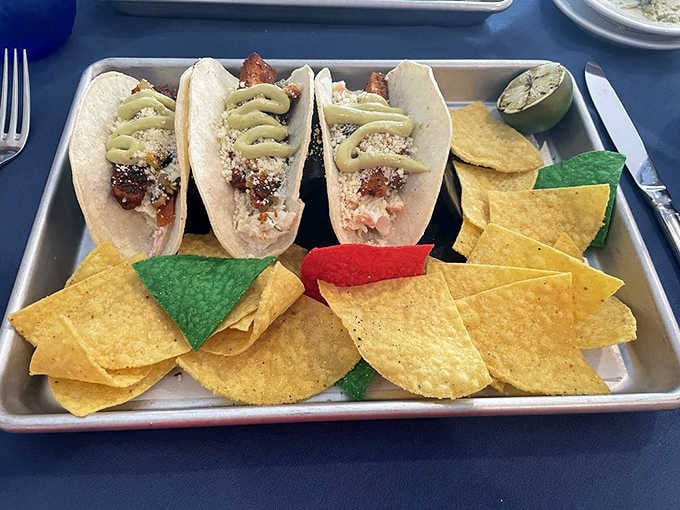 Three tacos on a tray, loaded and ready, proving that Boone Tavern keeps things interesting beyond the classics.