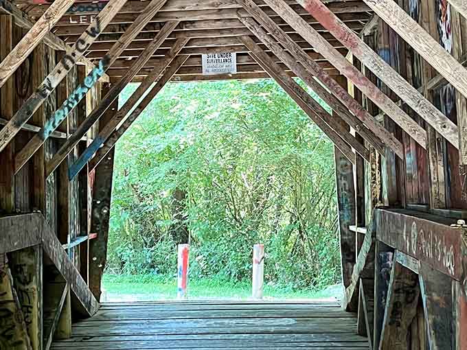 That "Site Under Surveillance" sign inside a haunted bridge is either very reassuring or deeply unsettling. You decide.