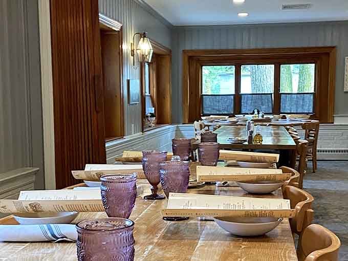 Purple glassware, wooden bowls, and long family-style tables, this room is ready to host your next favorite memory.