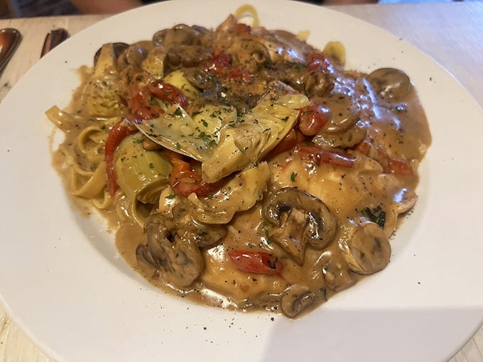 Pollo Mediterraneo crowned with artichoke hearts and mushrooms in cream sauce. Elegant, generous, and completely unapologetic about it.
