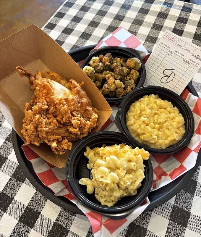 That golden fried chicken with macaroni and cheese and creamed corn is the kind of tray that stops conversations mid-sentence.