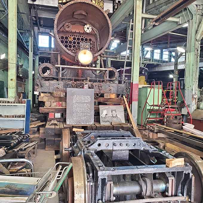 Steam engine 2156 sits mid-restoration, looking like it has a few more stories left to tell before it's done.