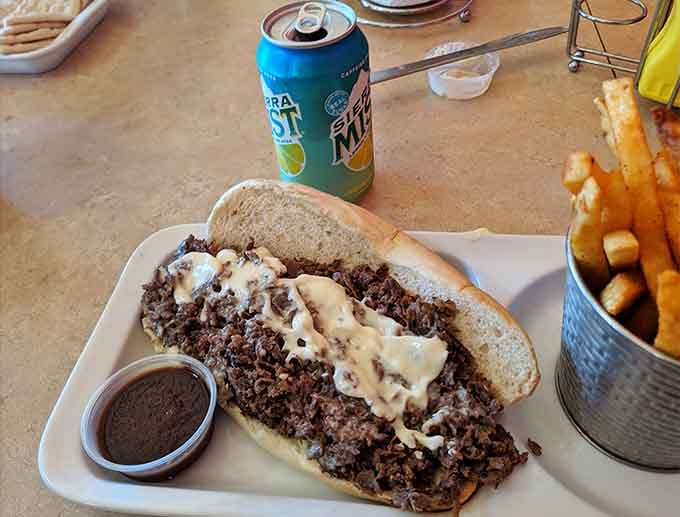 A Philly cheesesteak so loaded it requires both hands and possibly a game plan to eat without incident.