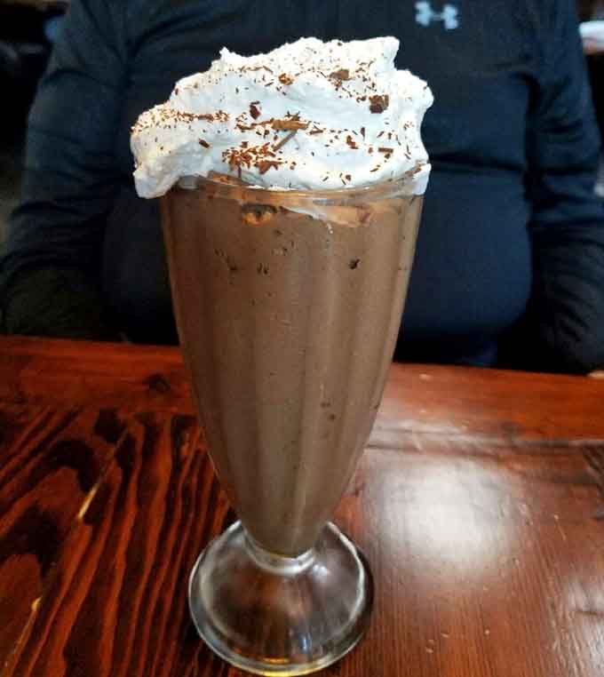 Towering whipped cream, chocolate shavings, and a creamy chocolate base. This milkshake is not here to make friends, it's here to win.