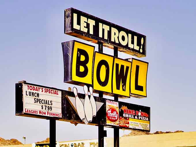 That vintage roadside sign stands proud against the Arizona sky, beckoning bowlers for decades now.