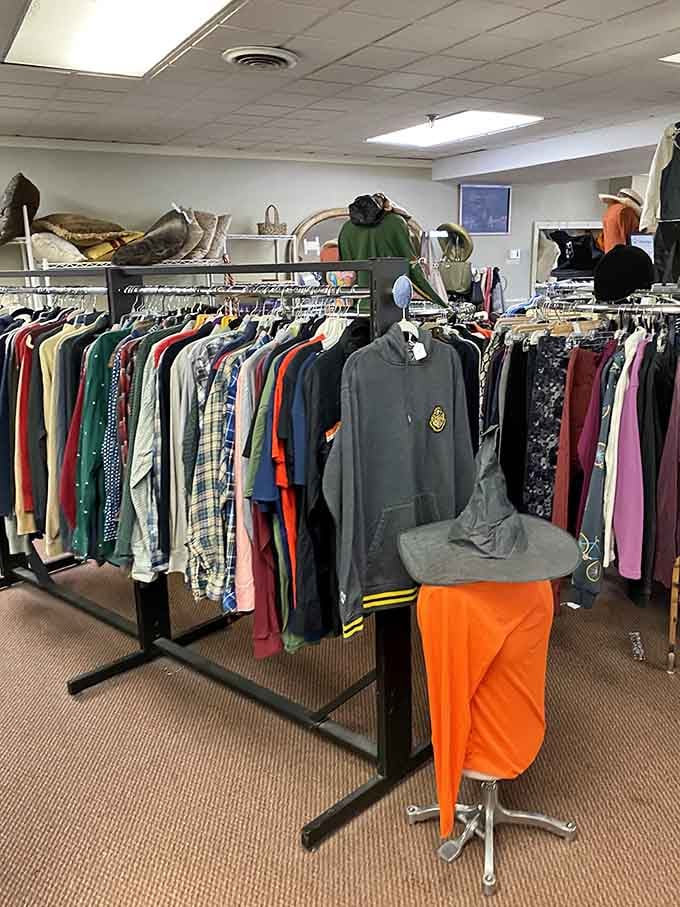 Flannel shirts, hoodies, and yes, a witch hat, because this is Salem and even the mannequins have a sense of humor.