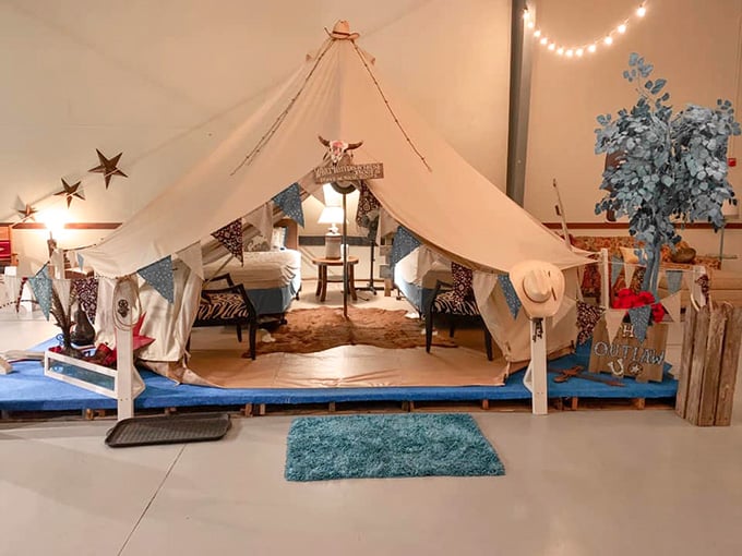 Star cutouts, cowhide rugs, and a cowskull sign. The Outlaw tent is pure Texas without apology.