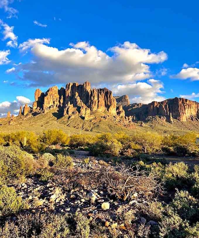 Clouds, golden light, and jagged peaks, the Superstition Mountains putting on their afternoon performance like they do every single day.