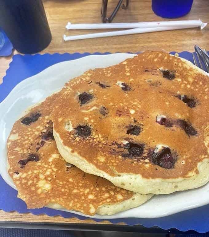 Blueberry pancakes this size could feed a small village or one very happy person with excellent priorities.