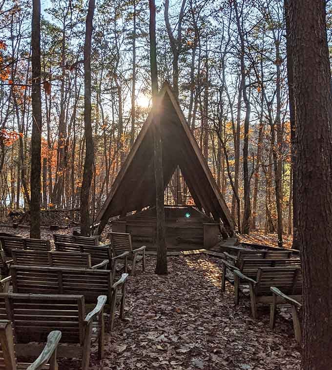 An A-frame chapel surrounded by fall trees, where even the sunlight shows up dressed for the occasion.