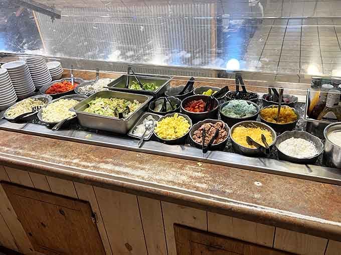 The salad bar offers vegetables for those pretending to be healthy before hitting the prime rib station.