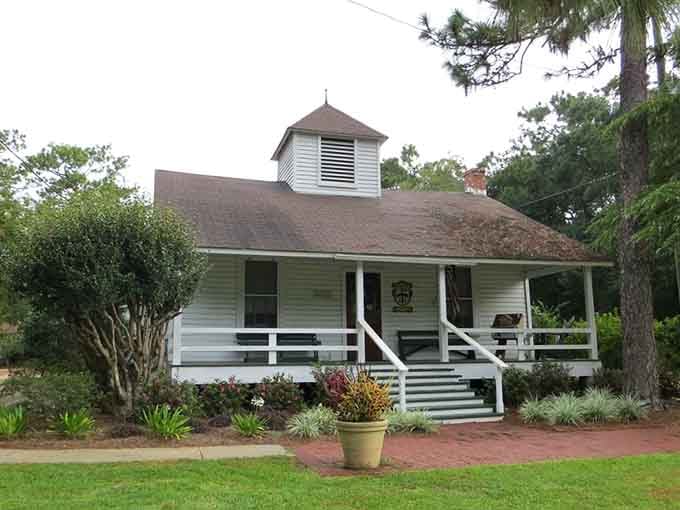A cupola, a covered porch, and a flower pot out front. This community hall means serious business, charmingly.