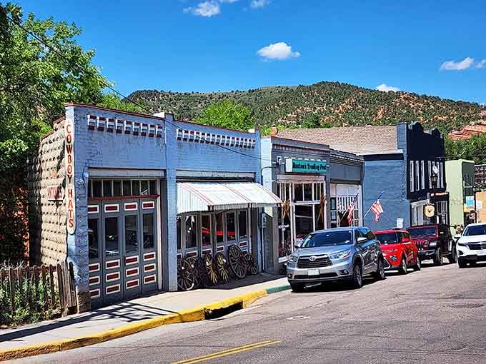 Old wagon wheels, colorful storefronts, and mountain views make this block feel like the American West at its most genuine.
